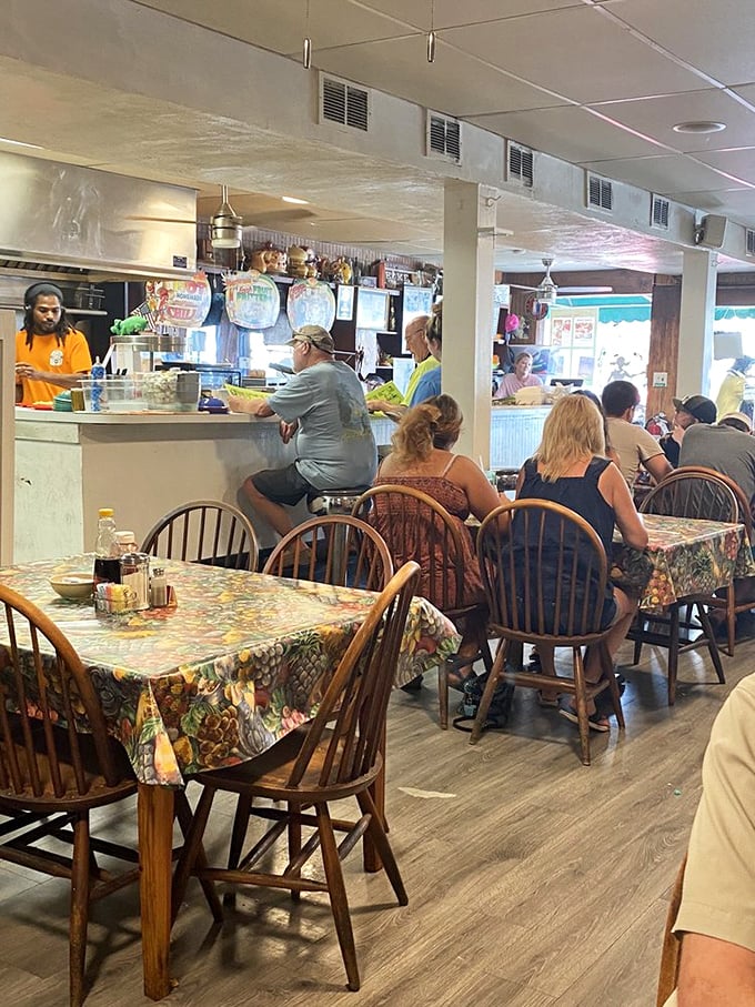 The dining room hums with conversation while servers navigate tables like they're conducting a breakfast symphony.