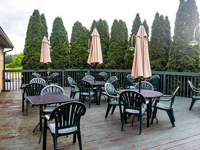 The outdoor patio&mdash;where summer evenings stretch like lazy cats, and umbrellas stand guard against anything that might interrupt perfect pint weather.