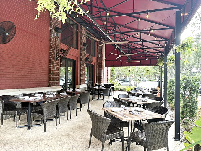 Outdoor dining under red awnings where the Florida breeze mingles with the aroma of garlic and basil. La dolce vita indeed.