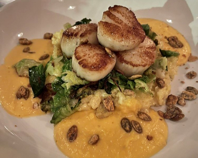 Scallops so perfectly seared they deserve their own Instagram account. Perched atop greens and surrounded by golden sauce like royalty.