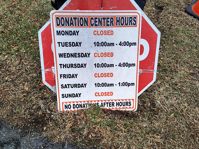 The donation hours sign&mdash;a gentle reminder that this thrifting ecosystem depends on the generosity of neighbors clearing out their closets.