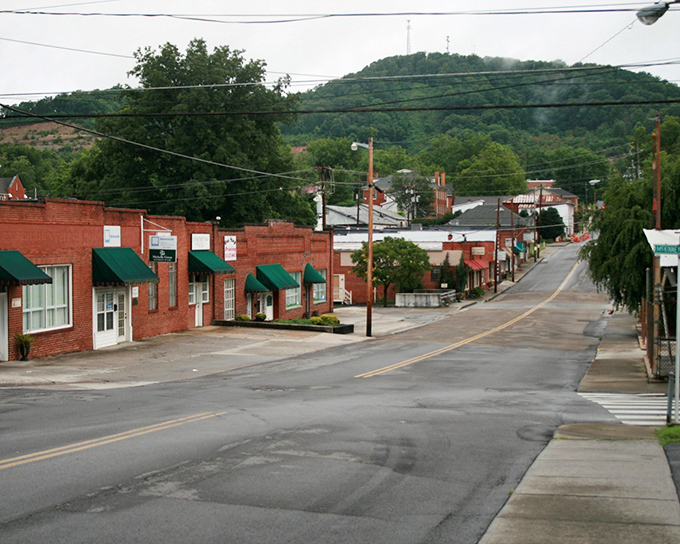 Green awnings punctuate the red brick buildings, creating a visual harmony that feels both timeless and perfectly of-the-moment.