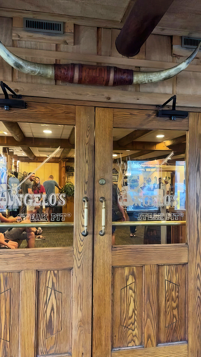 Impressive longhorns frame the entrance doors, a final reminder that you're entering serious steak territory.