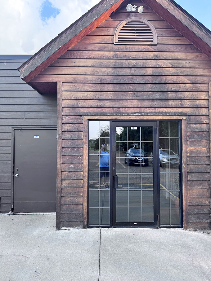 An entrance that doesn't need to shout to be noticed. That wooden doorway isn't just an entry point&mdash;it's a portal to comfort food nirvana.