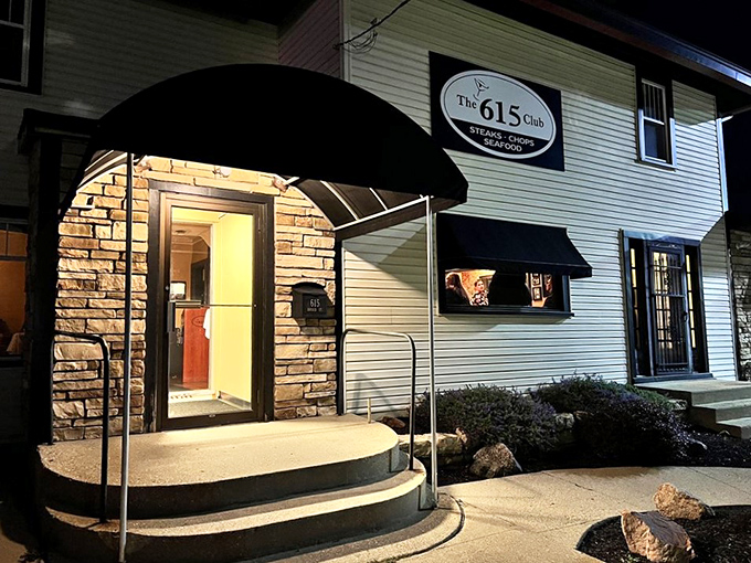 The welcoming entrance with its curved awning beckons hungry travelers like a lighthouse guiding ships to safe harbor.