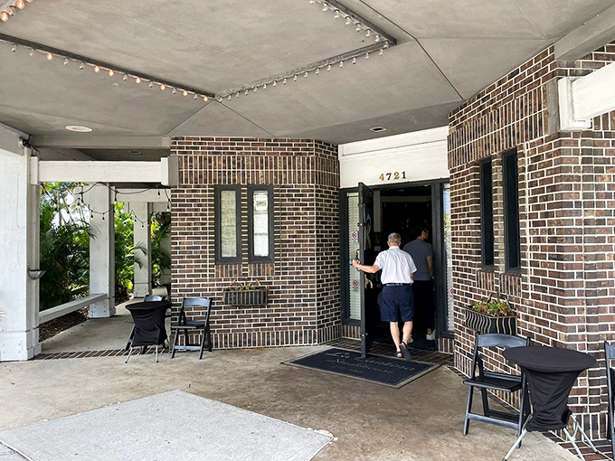 The brick entrance beckons hungry patrons like a portal to a parallel universe where calories don't count and steaks are always perfect.
