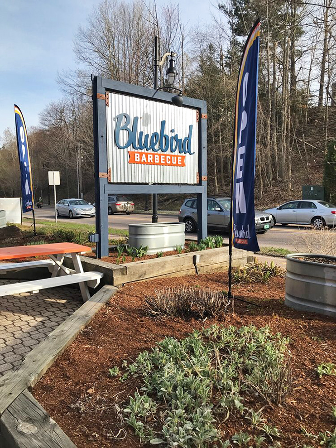 The entrance sign stands as a beacon to barbecue pilgrims. Like a lighthouse guiding hungry sailors to the shores of smoked meat paradise.