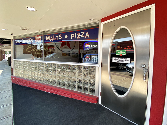 The oval window in this chrome door offers a peek into a world where calories don't count and comfort is always on the menu.