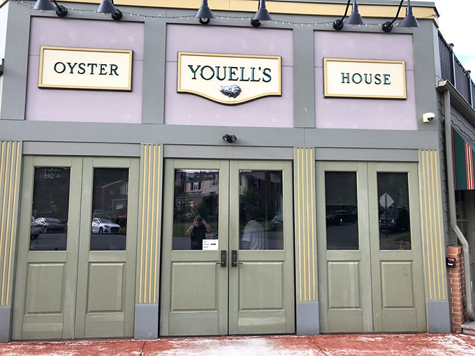 An entrance that promises maritime delights beyond its doors. The classic signage and green exterior set expectations that the kitchen consistently exceeds.