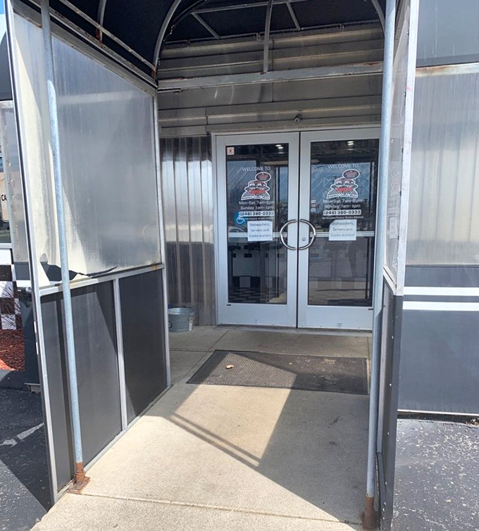 The entrance vestibule serves as your decompression chamber between the modern world and 1950s breakfast paradise.