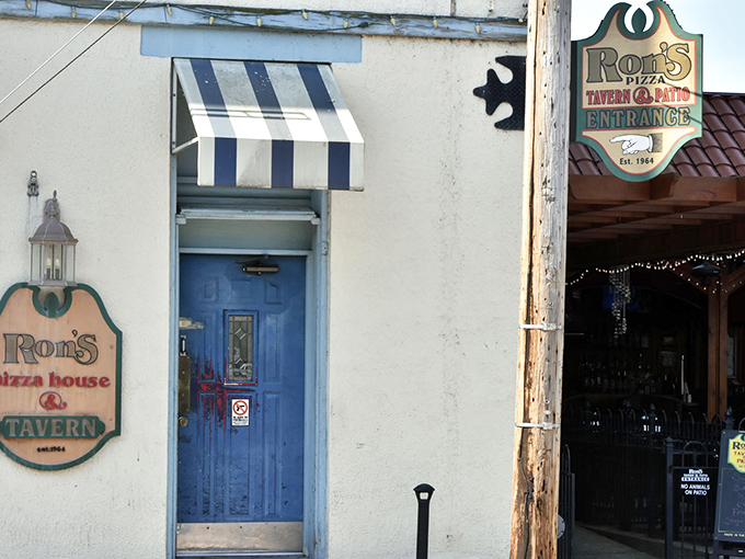 The blue door entrance to Ron's Tavern side hints at the establishment's dual personality&mdash;part family pizza joint, part neighborhood watering hole.