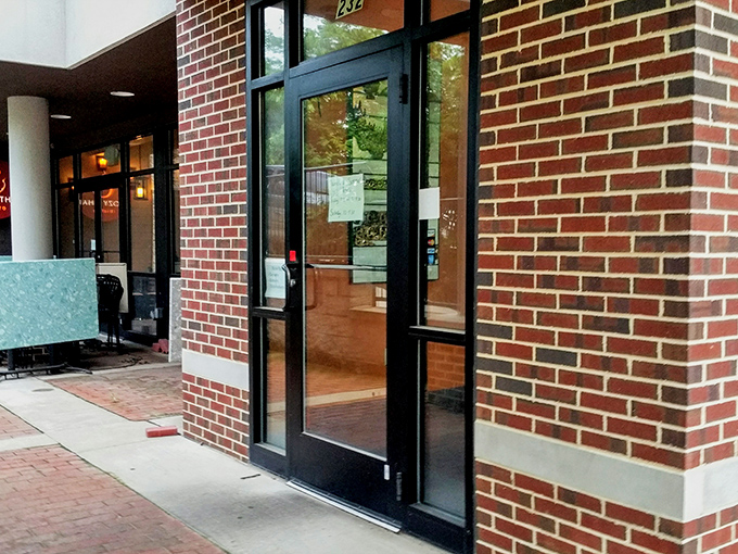 Even the entrance feels like a portal to somewhere special. That door has welcomed thousands of hungry souls seeking curry enlightenment.