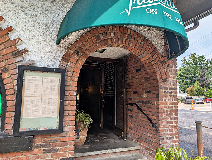 The entrance beckons with the promise of garlic-scented air and the sound of Frank Sinatra floating through brick-lined doorways.