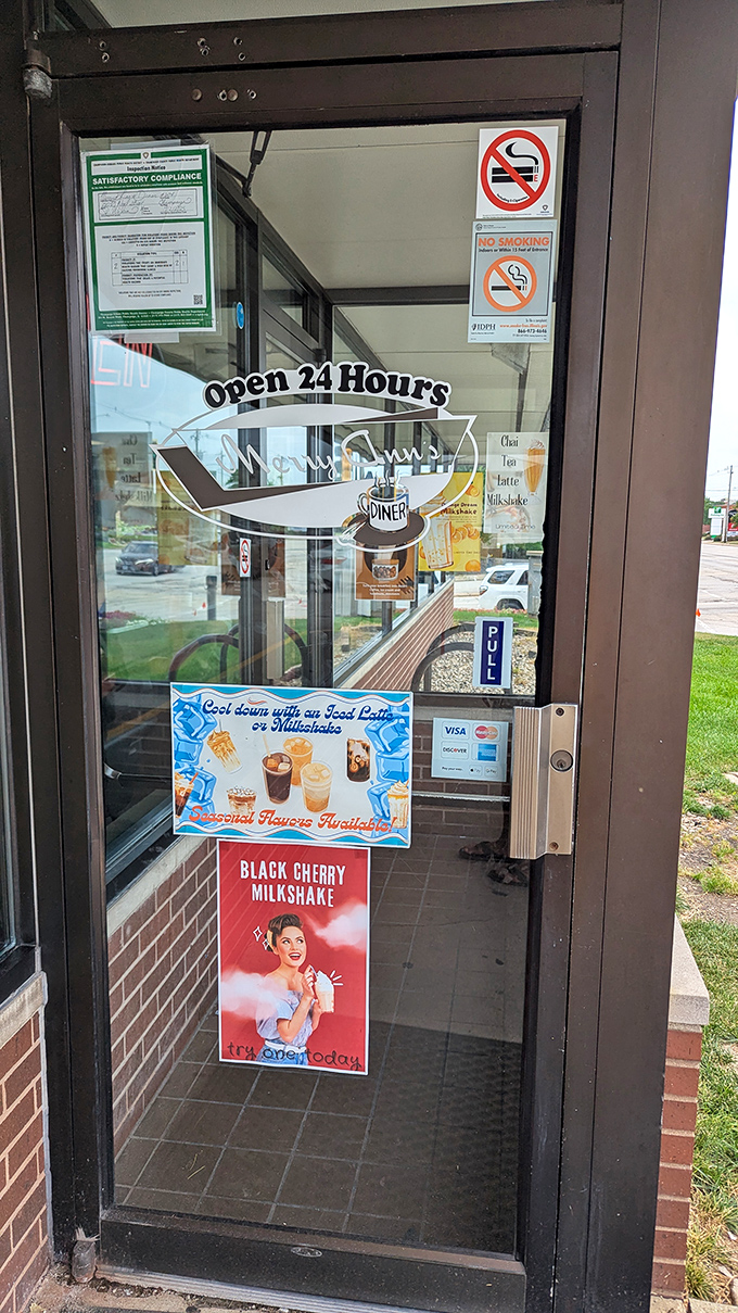 The entrance promises what lies within: unpretentious, 24-hour comfort that's been "Cookin' It Up" for decades.