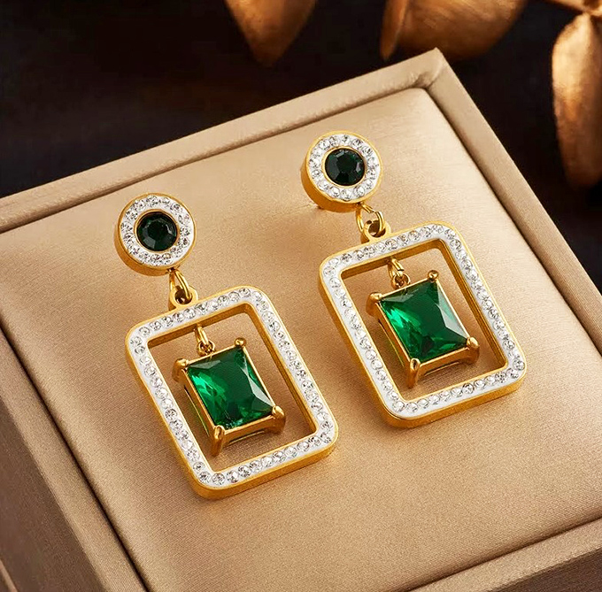 Elegant emerald earrings that prove treasure hunting at flea markets occasionally yields genuine gems among the everyday finds.
