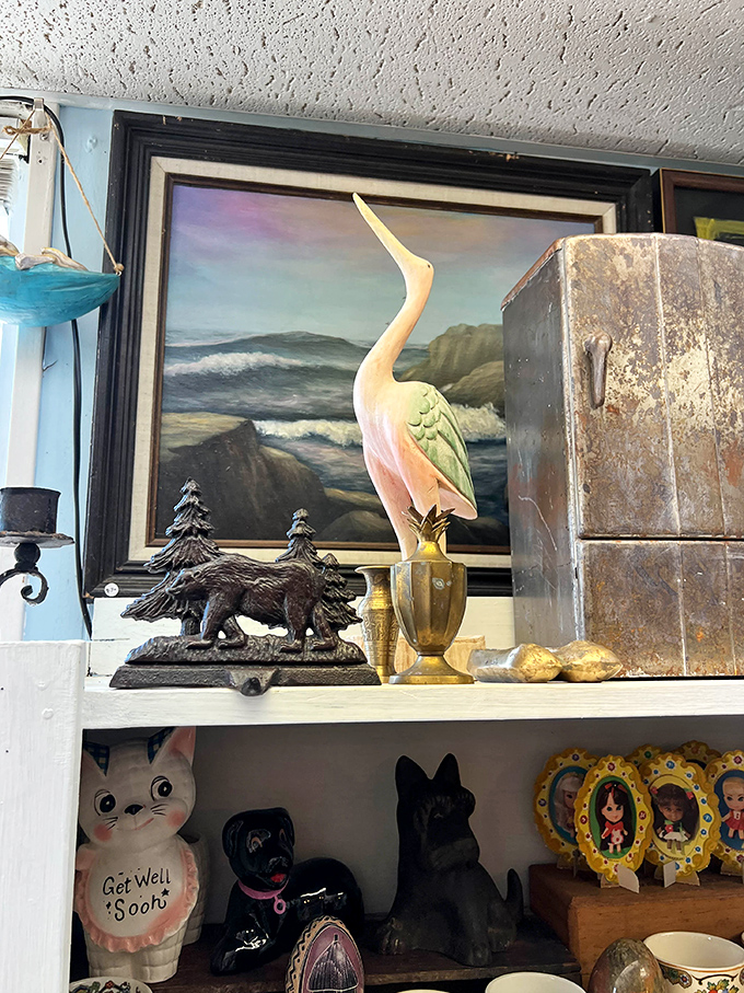 Coastal kitsch at its finest&mdash;where a pastel heron stands guard over vintage bear bookends and seascape paintings.