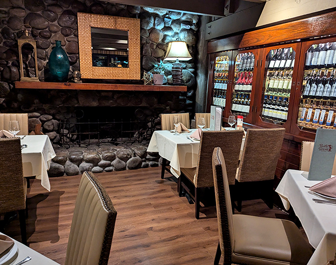 A cozy stone fireplace adds warmth to the dining experience, creating ambiance that makes you want to linger over every course.