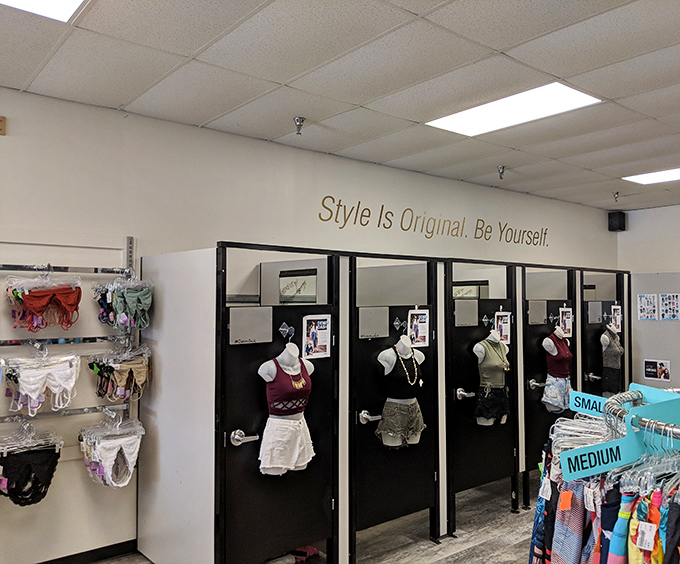 Fitting rooms that actually fit human bodies, with a motivational message that reminds you why secondhand shopping is the ultimate style statement.