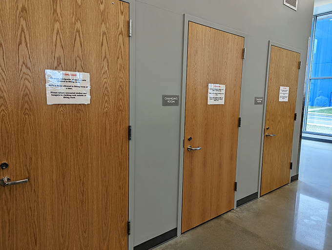 Behind these wooden doors lie the transformation chambers where thrift store optimism meets mirror-based reality checks.
