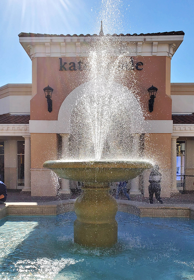 A fountain creates a moment of zen amid shopping frenzy, hypnotizing visitors into believing they need just one more store.