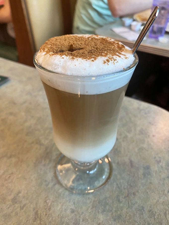 This isn't just coffee—it's a layered masterpiece in a glass, proving diners understand luxury better than five-star hotels.