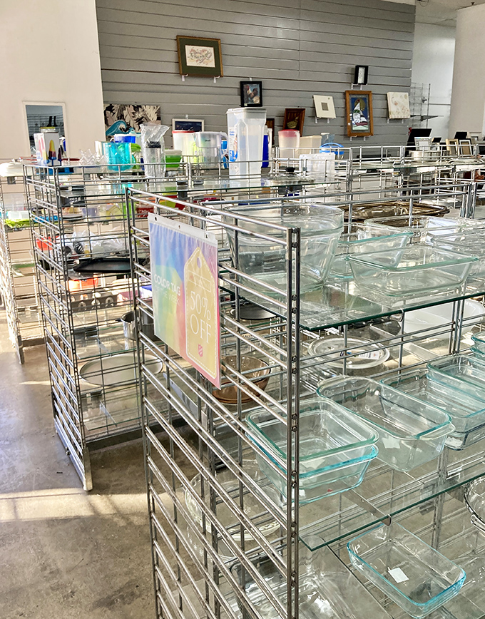 Glassware galore, arranged with museum-like precision. Each Pyrex dish represents decades of family dinners and potluck contributions.