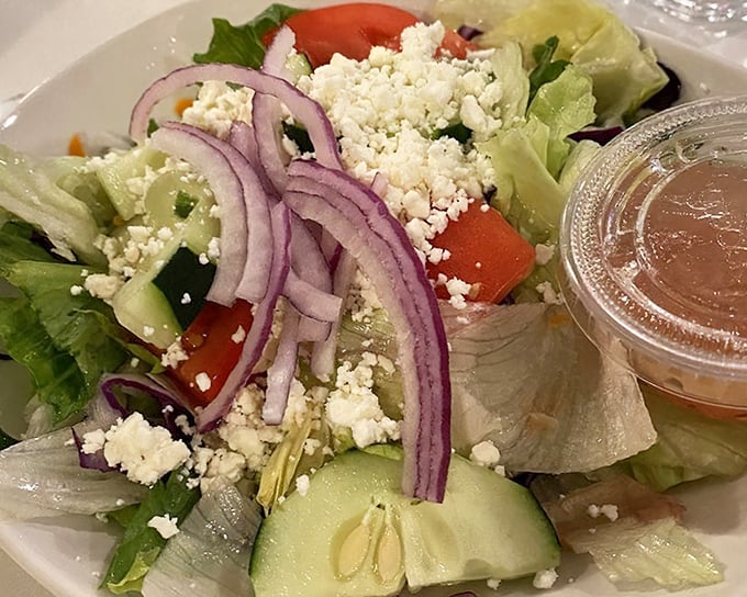 A Greek salad that would make Zeus himself put down his lightning bolt and pick up a fork. Those red onions mean business.