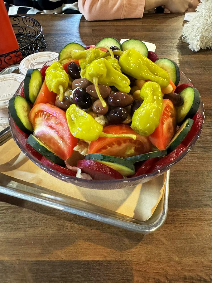 The Greek salad provides a fresh, vibrant counterpoint to all that smoky meat&mdash;like a palate-cleansing intermission at the barbecue symphony.