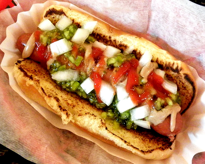Fresh salsa and diced onions transform this dog into a fiesta on a bun. It's what happens when a hot dog decides to salsa dance.