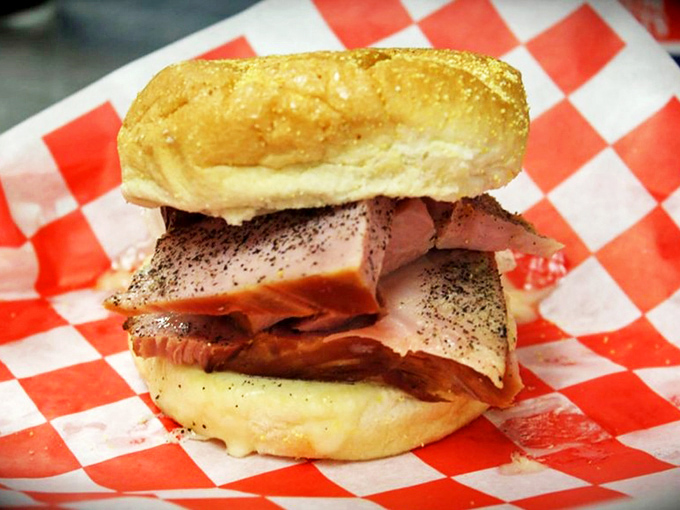 Ham stacked so generously it's practically a meat skyscraper, proving that sometimes the simplest sandwiches deliver the most satisfaction.