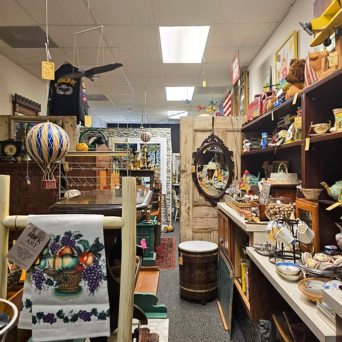 Every shelf in this booth tells a different story. That hot air balloon model has probably inspired more daydreams than actual travel plans.