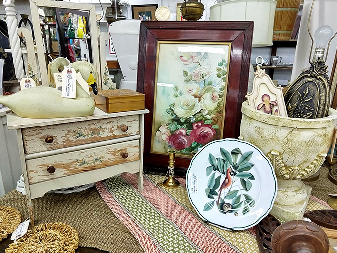 This shabby-chic vignette proves that peeling paint and vintage botanical prints are the secret ingredients of Pennsylvania farmhouse charm.