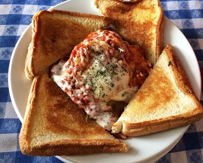 Lasagna surrounded by perfectly toasted bread&mdash;the Italian-American dream team. This isn't just lunch; it's a warm hug disguised as pasta.
