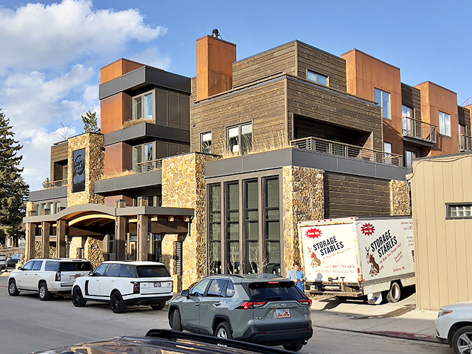 Contemporary accommodations rise against the mountain backdrop, offering luxury that doesn't forget where it's located geographically.