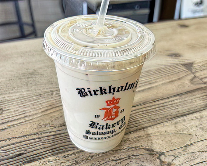 The branded cup isn't just holding a vanilla latte&mdash;it's containing liquid happiness that's been perfected since 1951, no passport required.