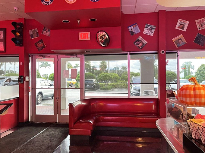 The entrance doesn't just welcome you&mdash;it embraces you with that signature red vinyl, promising comfort before you've even ordered your first cup of coffee.