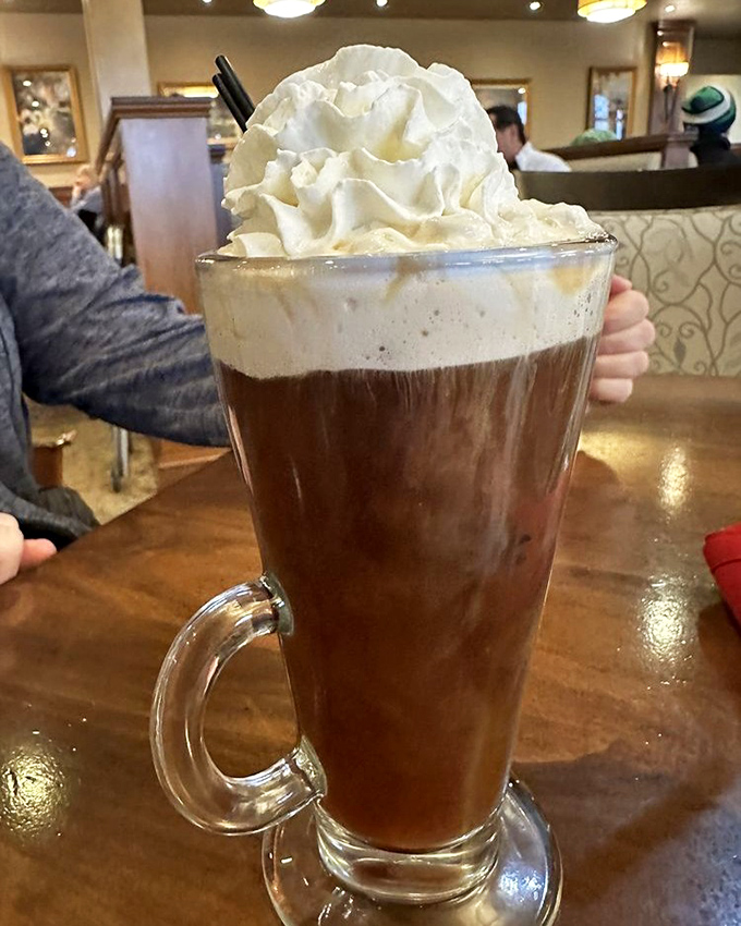 Irish coffee topped with a cloud of whipped cream&mdash;where "I shouldn't have dessert" meets "but it has coffee in it."