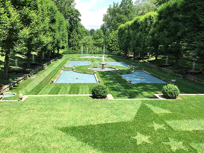 Geometric pools create a symphony of blue amid perfect lawns. This Italian-inspired water garden makes you feel like you've stepped into Renaissance royalty's backyard.