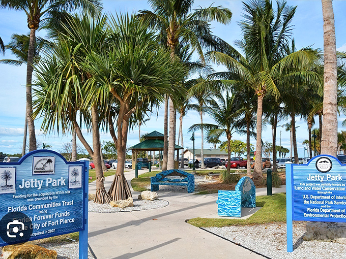 Jetty Park's entrance promises fishing adventures and beach access with swaying palms standing guard. No theme park characters required for authentic fun.