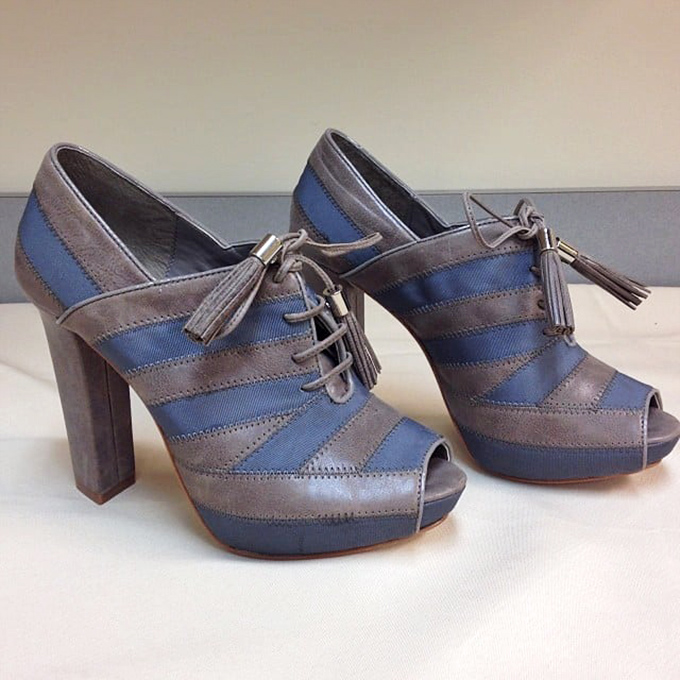 These blue and gray platform shoes prove that yesterday's fashion splurges become today's affordable statement pieces for the savvy shopper.