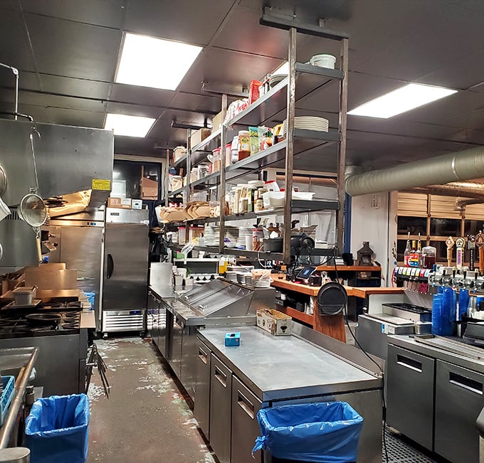 The kitchen where magic happens. Stainless steel and efficiency&mdash;the engine room powering your seafood adventure.