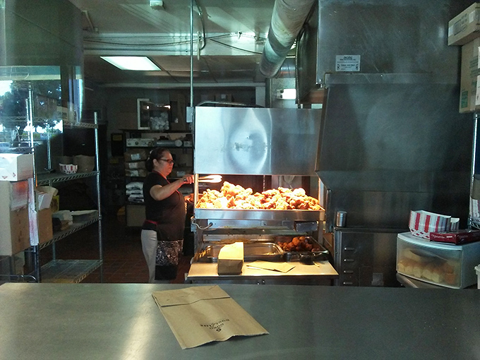Where the magic happens: industrial fryers churning out chicken perfection while most restaurants are still Instagramming their exposed brick walls.
