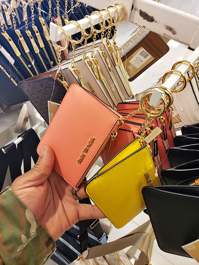 Michael Kors key fobs and coin purses&mdash;the gateway purchases to designer addiction. That coral shade isn't just a color&mdash;it's an investment in your handbag future.