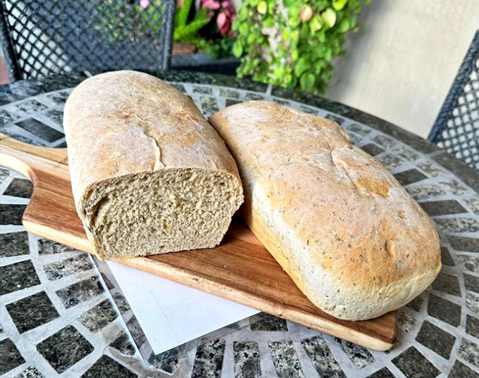 Artisan bread that looks so good, you'll want to cancel dinner plans and just eat the whole loaf with butter.