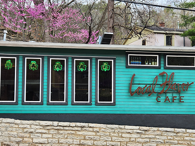 Local Flavor Cafe's turquoise exterior pops against the limestone foundation, promising a meal as colorful as the town itself.