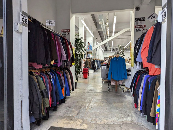 The unassuming entrance to retail paradise, where ordinary sidewalks lead to extraordinary shopping adventures and countless possibilities.