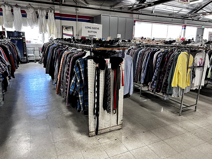 Button-down shirts organized with military precision. Plaids, solids, and stripes waiting to upgrade someone's work wardrobe without downgrading their bank account.