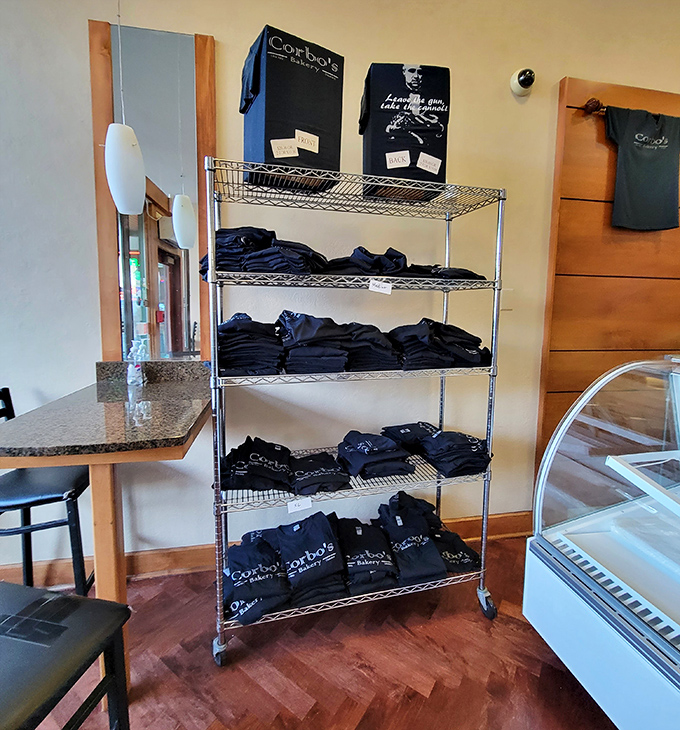 Corbo's merchandise rack&mdash;because wearing their logo is the next best thing to wearing their cannoli. Calories not included with t-shirt purchase.