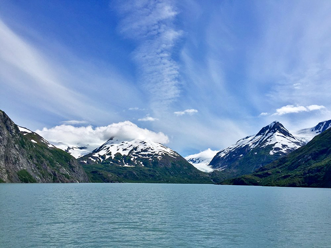 Glacial waters create the perfect foreground for snow-dusted mountain majesty. Alaska's version of a blue mood&mdash;the kind that actually improves your day.