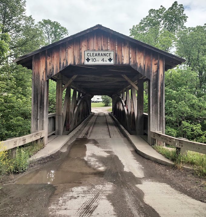 After rain, the bridge's entrance takes on a moody, cinematic quality&mdash;ready for its close-up in a period film.